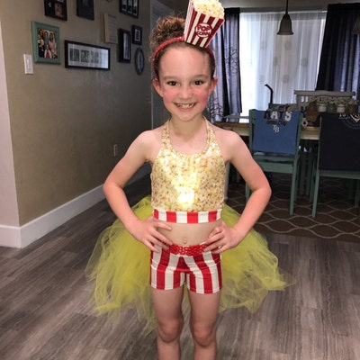 The box of Popcorn Crop Top Sports Bra, Spandex Shorts, and Optional ...