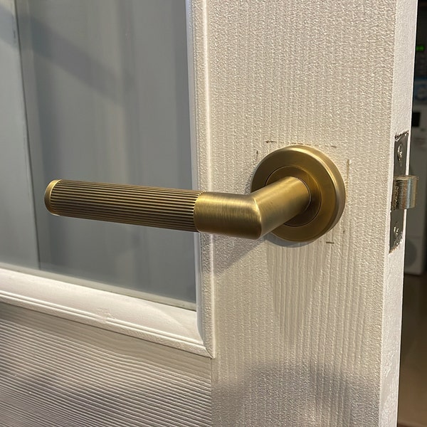 Lines Lever on Round Rose Door Handle. Pair of Door Handles on ...