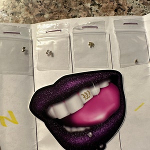 18k Gold LOGO Tooth Gems - Etsy