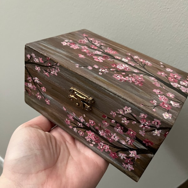 Wooden Key Holder With Colorful Houses and Green Plants on a Wild ...