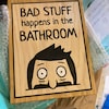 Bob's Burgers Bad Stuff Happens in the Bathroom Wooden Sign Wall Decor ...