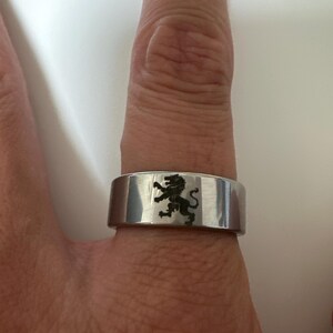 Howling Wolf in Front of Full Moon on a Boulder Rock Forest Tree Scene ...