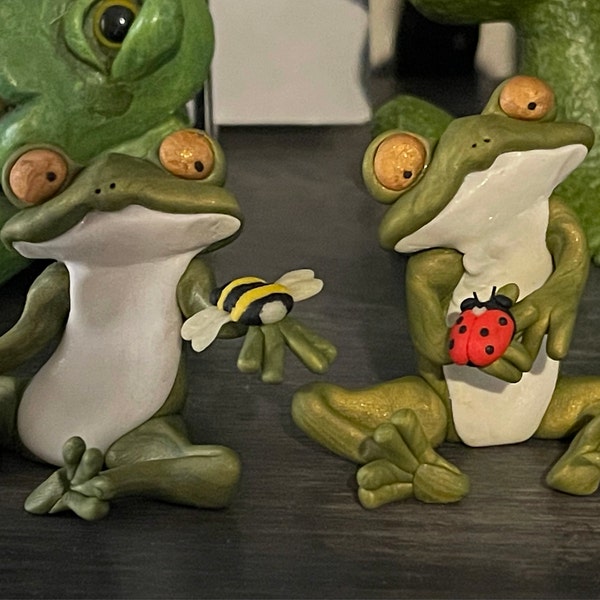 Clay Frog Hanging off a Piece of Driftwood With a Ladybug on His Foot ...