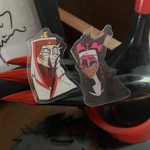 IN STOCK: Lucifer and Alastor Radioapple Nun Hazbin Hotel Keychains - Etsy