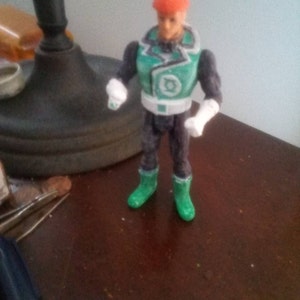 Batcave Trophy Room With Robin Memorial, Giant Penny, Penguin, and ...