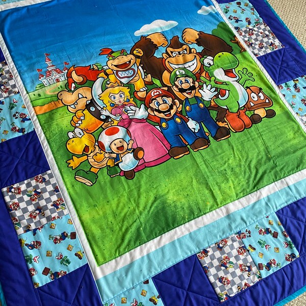 Nintendo® Super Mario Mario Toss Light Blue Cotton by the Fat Quarter ...
