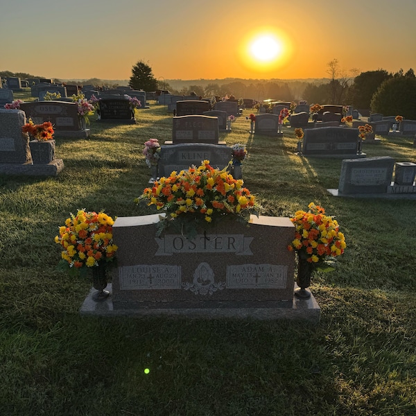 This Headstone Saddle Has Silk Grave Flowers Including Cream Calla ...