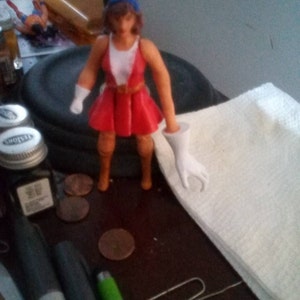 Batcave Trophy Room With Robin Memorial, Giant Penny, Penguin, and ...