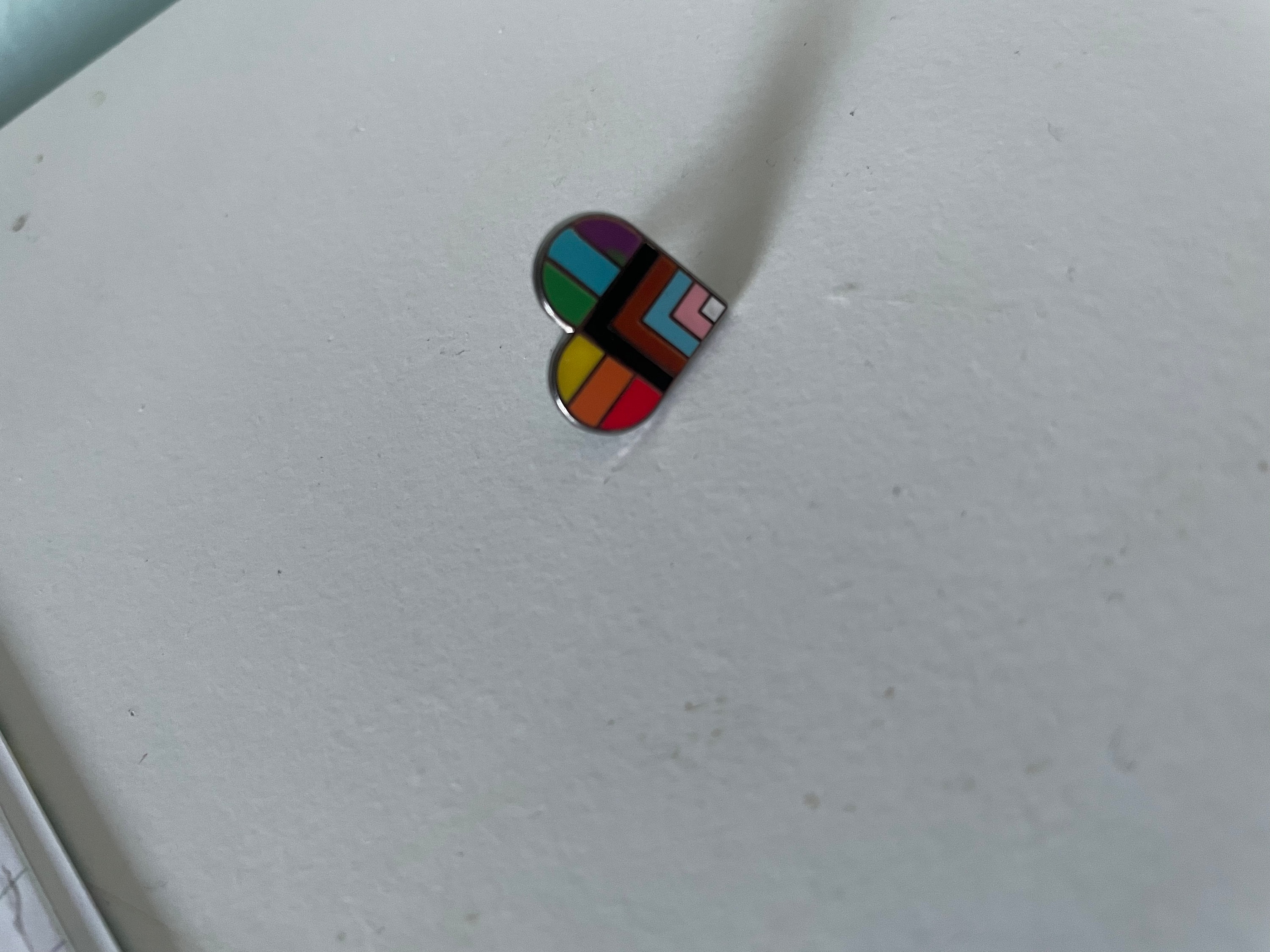 The Progress Pride Rainbow Heart Pin