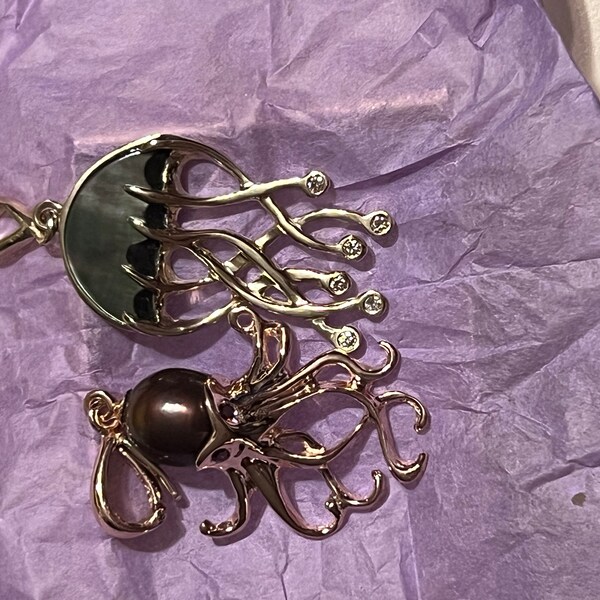 This "octopus Treasure" Pendant Has a Sweet Little Octopus Holding on ...