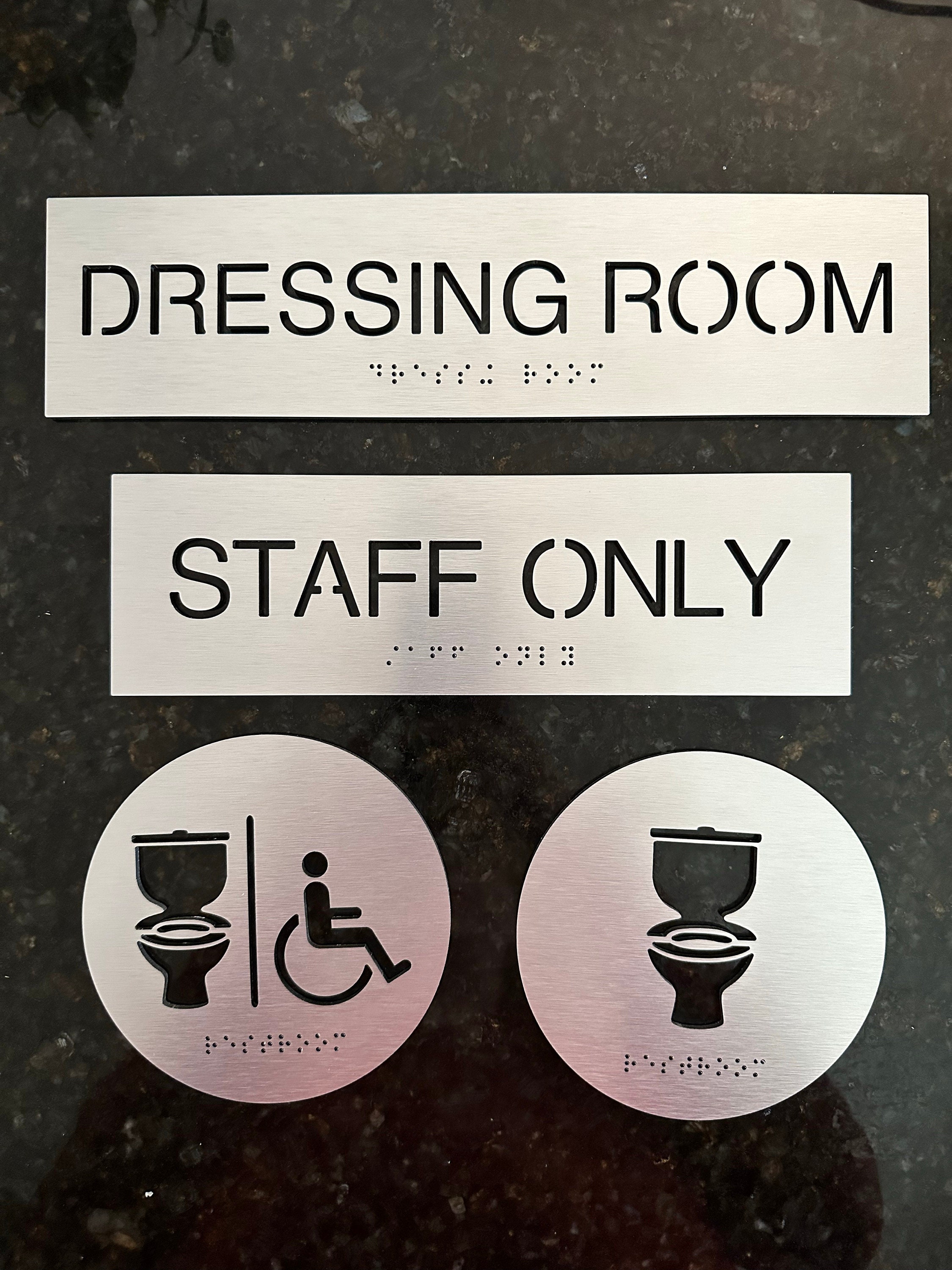 Aluminum toilet symbol sign. Bathroom sign. Restroom signage.