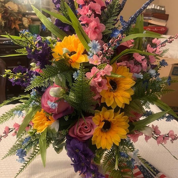 Pink and Yellow. Ranunculus, and Roses Grave Flower Arrangement ...