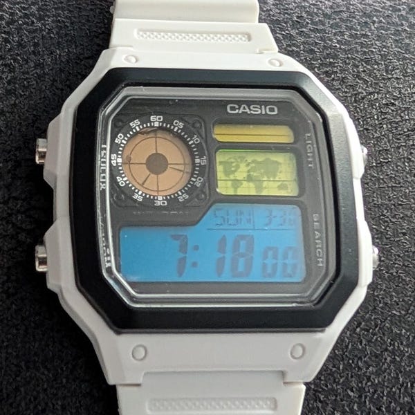 Casio World Time Illuminator Silver Watch With Black Nylon Band, AE ...
