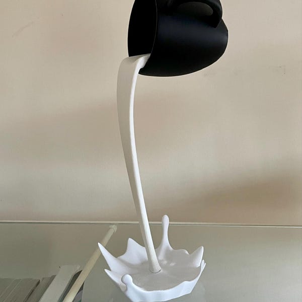 Gravity-defying Liquid Sculpture, Frozen in Time, a Cup Pouring Liquid ...