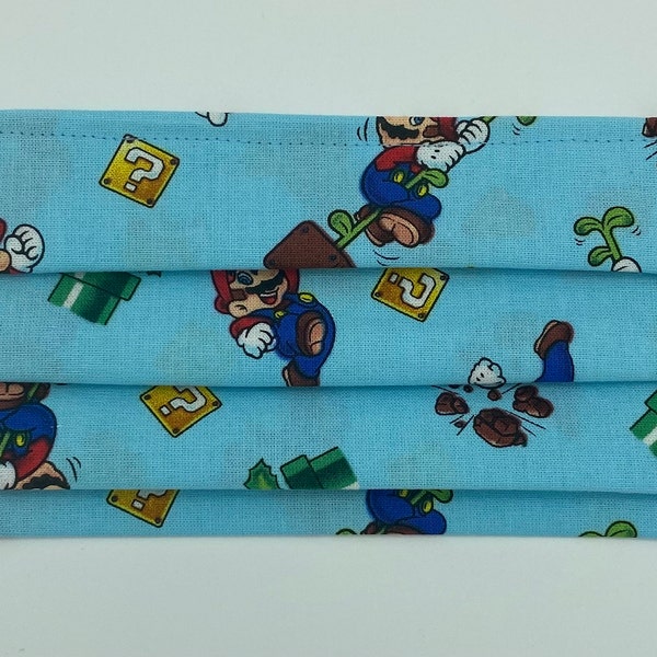 Nintendo® Super Mario Mario Toss Light Blue Cotton by the Fat Quarter ...