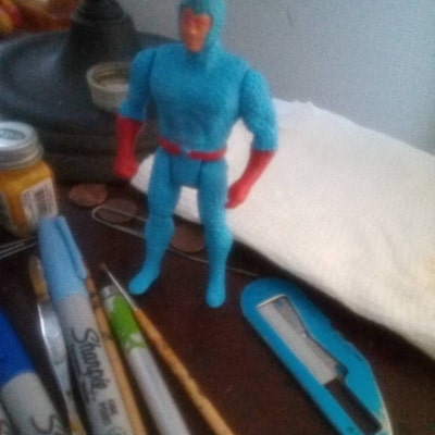 Batcave Trophy Room With Robin Memorial, Giant Penny, Penguin, and ...