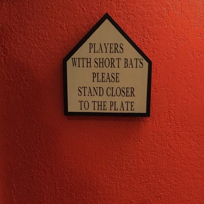 Humorous Bathroom Sign.....players With Short Bats Please Stand Closer ...