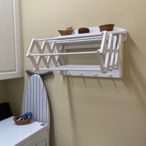 Modern Look White Wall Hanging Drying Rack shown on Unfinished Mount ...