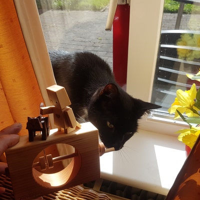 Tiny Robot Clothespin Automaton Flying a Kite it Pulls on the Kite ...