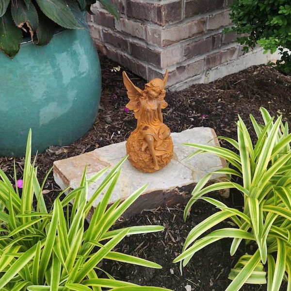 Gorgeous Garden Fairy - Cast Iron Elf Sitting on a Sphere of Flowers ...