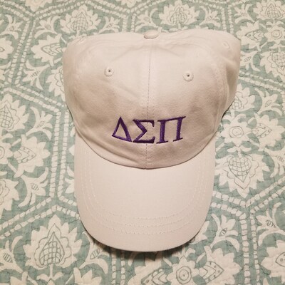 Two Line Greek Letters Dancing Script Baseball Cap Officially Licensed ...