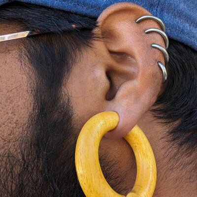 A Pair of Bali Cax Hammered Golden Brass Sono Rosewood Double Flared ...