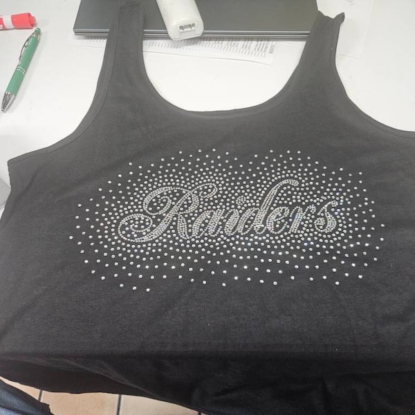 Cursive Raiders With a Firework Splash Around It Rhinestone Bling Shirt ...
