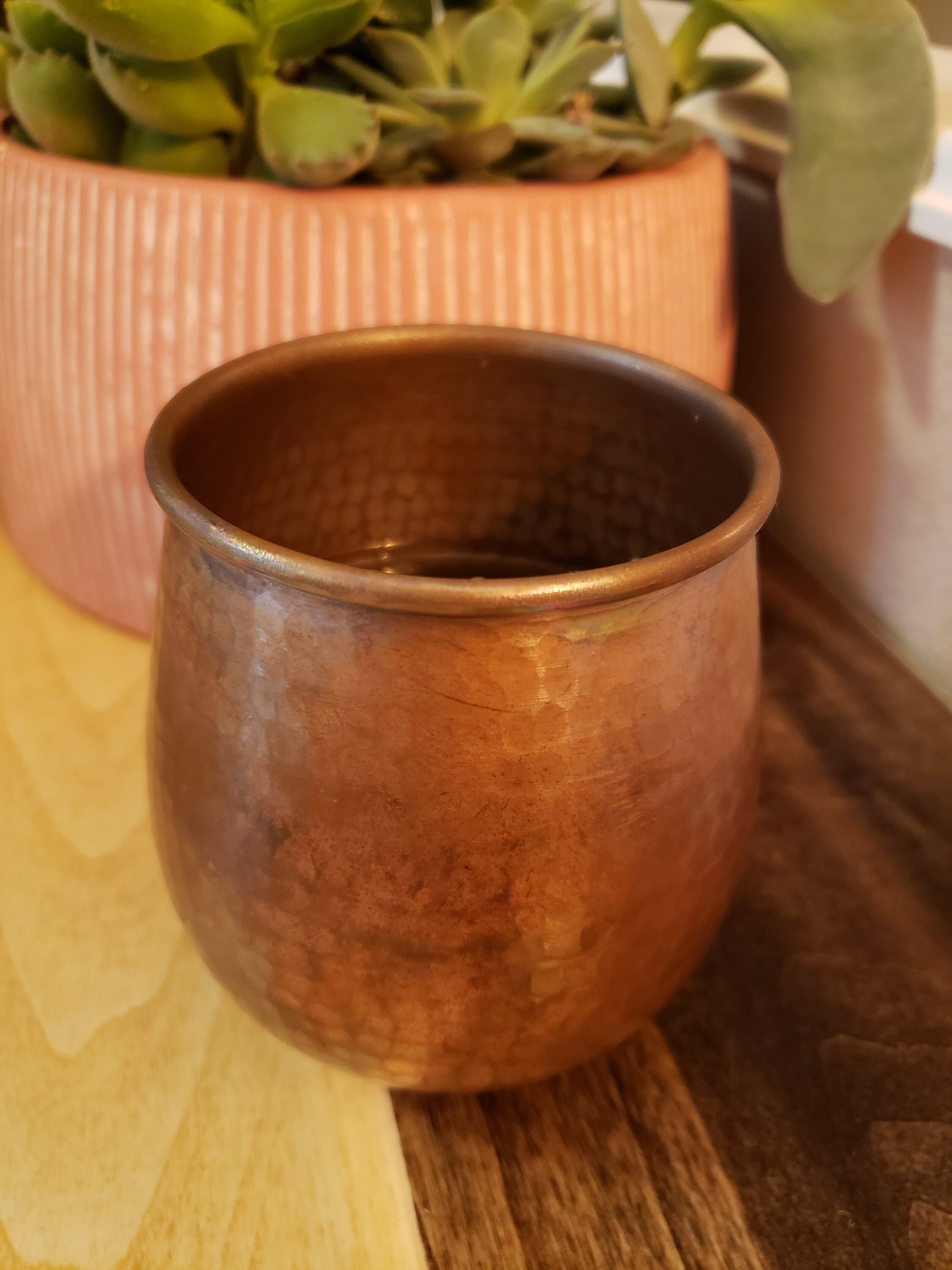 Hammered copper stemless wine glass with brown patina finish