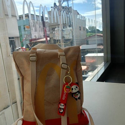 Quirky KRISPY KREME DOUGHNUT Backpack and Sling Crossbody Bag for Man ...