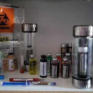 Resident Evil Umbrella Corporation Double Helix Auto Injector. - Etsy