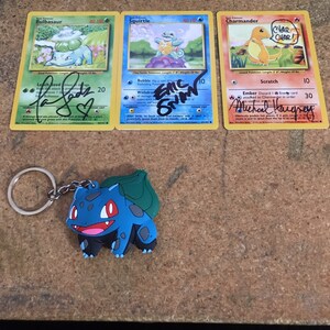 Autographed Pokemon Cards Get All 3 Starters Signed by Actors Who ...