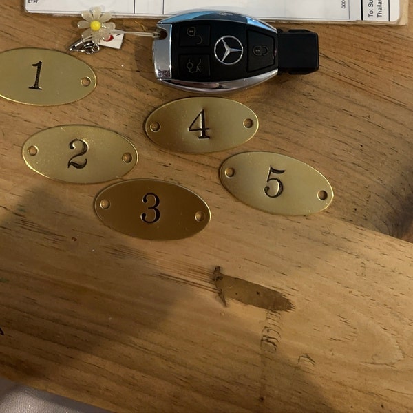 Hand Punched Brass Oval Numbered Tags - Custom Numbered Locker Tags ...