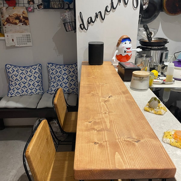 Wooden Breakfast Bar Wall Mounted on Stylish Steel Brackets With a ...
