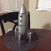 Moon Rocket Coin Bank With One Spaceman - Item #924, Cast Aluminum and ...