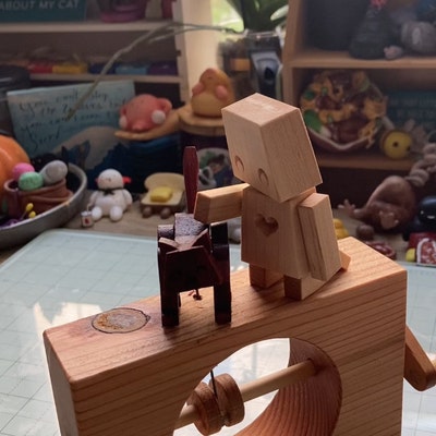 Tiny Robot Clothespin Automaton Flying a Kite it Pulls on the Kite ...