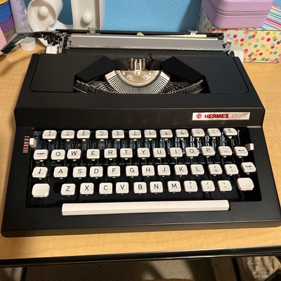 SALE A Vintage Adler Tippa Typewriter, a Smaller Brown Typewriter With ...