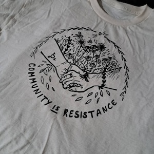 Community is Resistance T Shirt - Etsy
