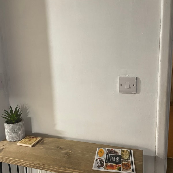 Wooden Breakfast Bar Wall Mounted on Stylish Steel Brackets With a ...