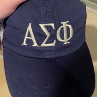 Two Line Greek Letters Dancing Script Baseball Cap Officially Licensed ...