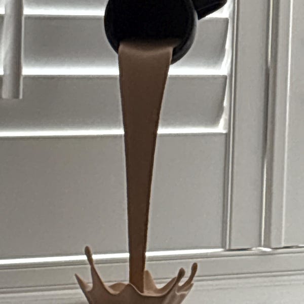 Gravity-defying Liquid Sculpture, Frozen in Time, a Cup Pouring Liquid ...