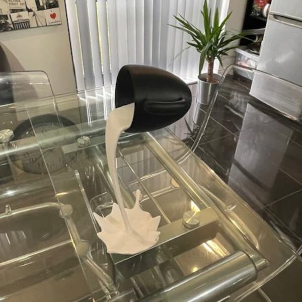 Gravity-defying Liquid Sculpture, Frozen in Time, a Cup Pouring Liquid ...