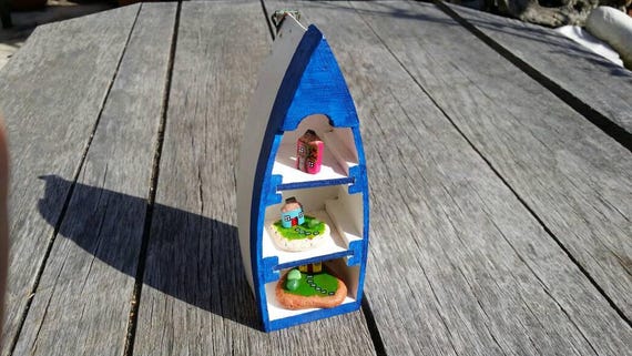 Miniature display shelf. Boat shape display. Beach themed
